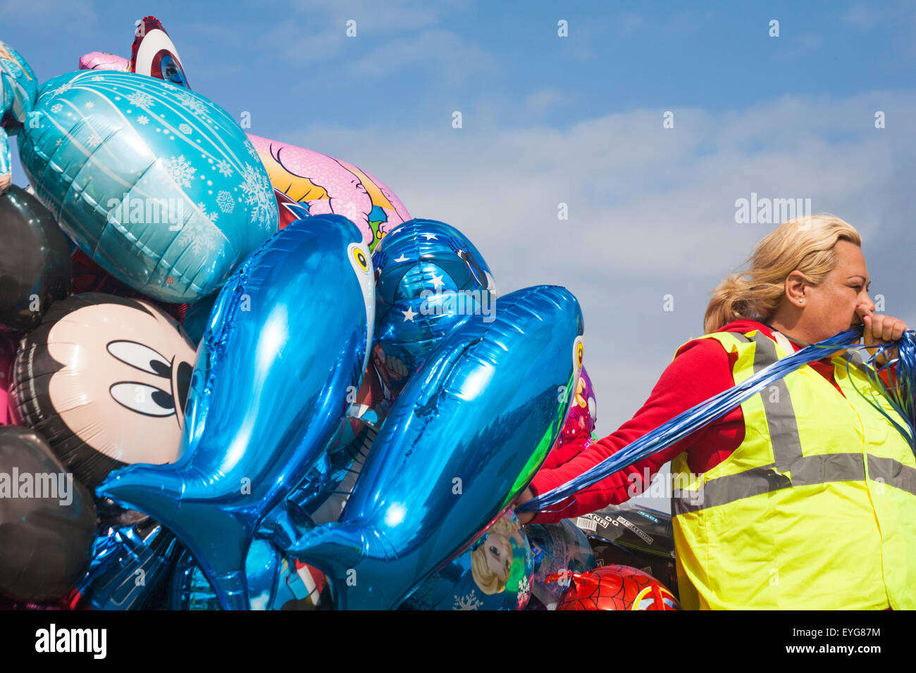 Helium balloon seller hi-res stock photography and images - Alamy