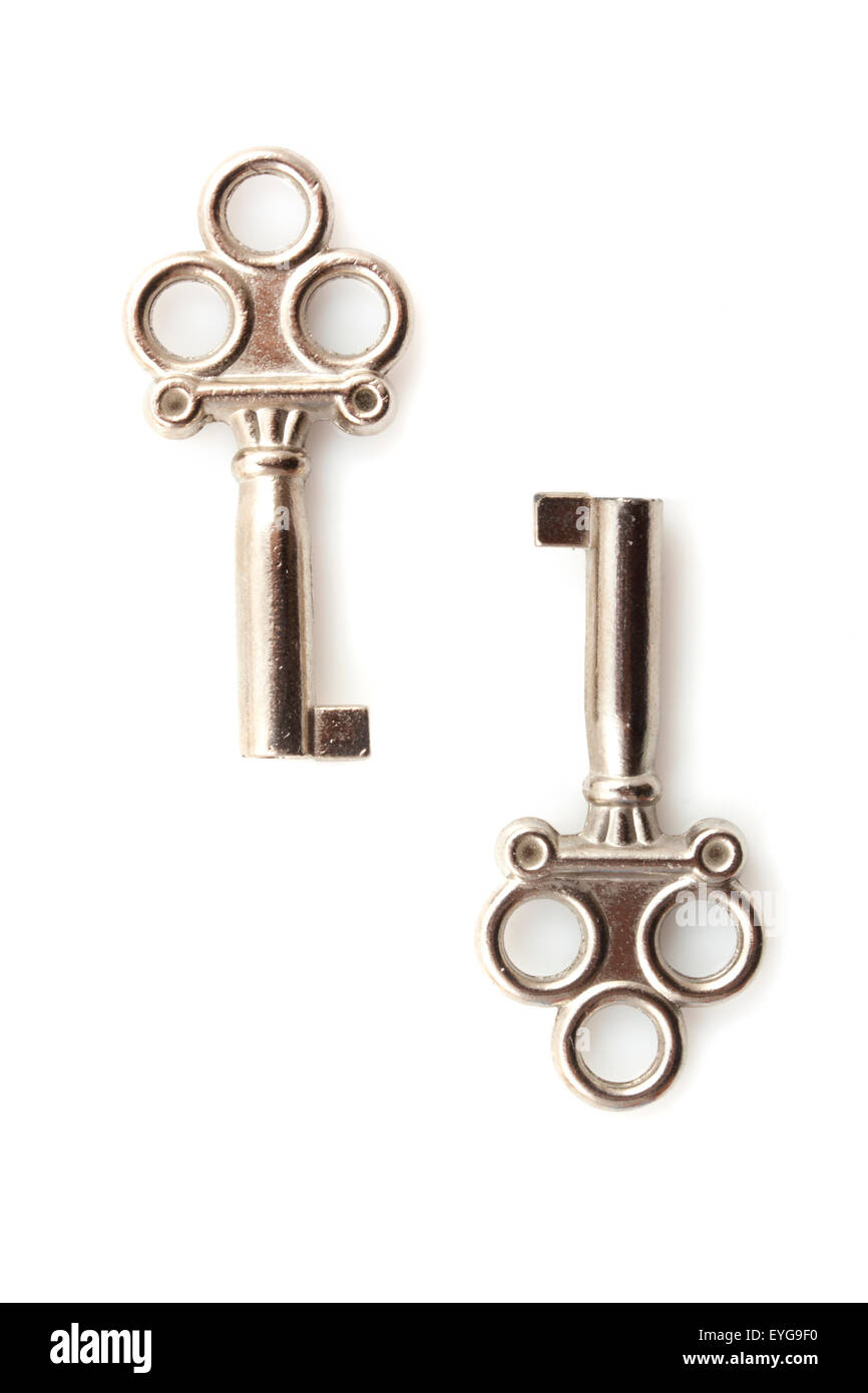 Two silver creative keys on a white background Stock Photo - Alamy