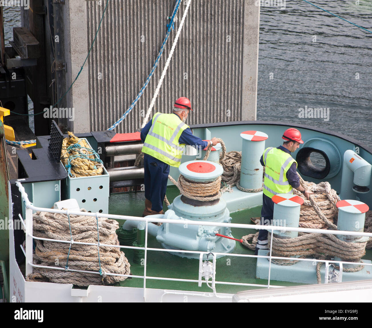 Ship workers on Caledonian MacBrayne ferry leaving Castlebay, Barra ...