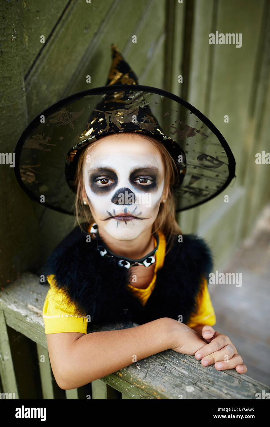 Sullen girl in Halloween costume looking at camera Stock Photo - Alamy
