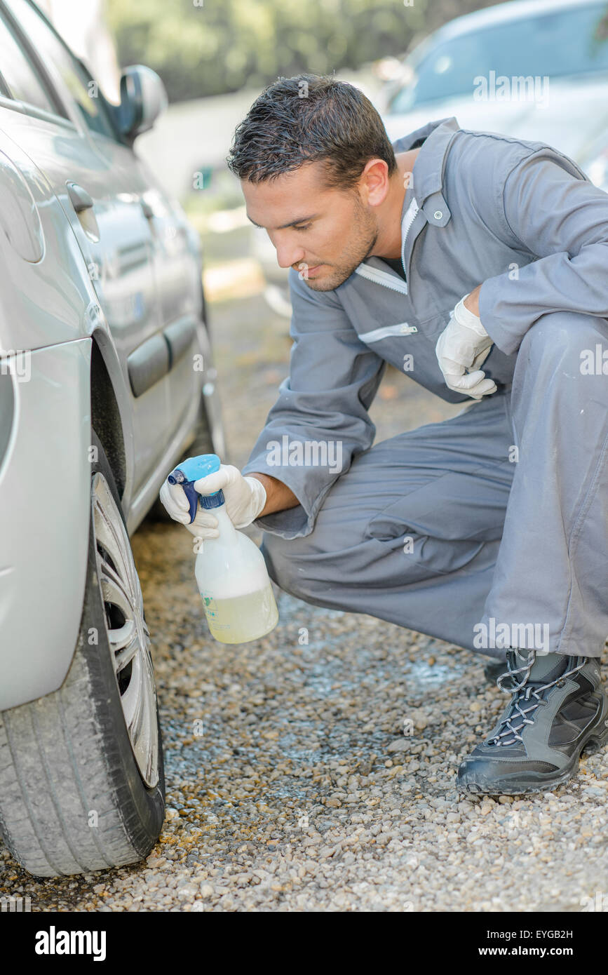Mechanic cleaning a car Stock Photo - Alamy