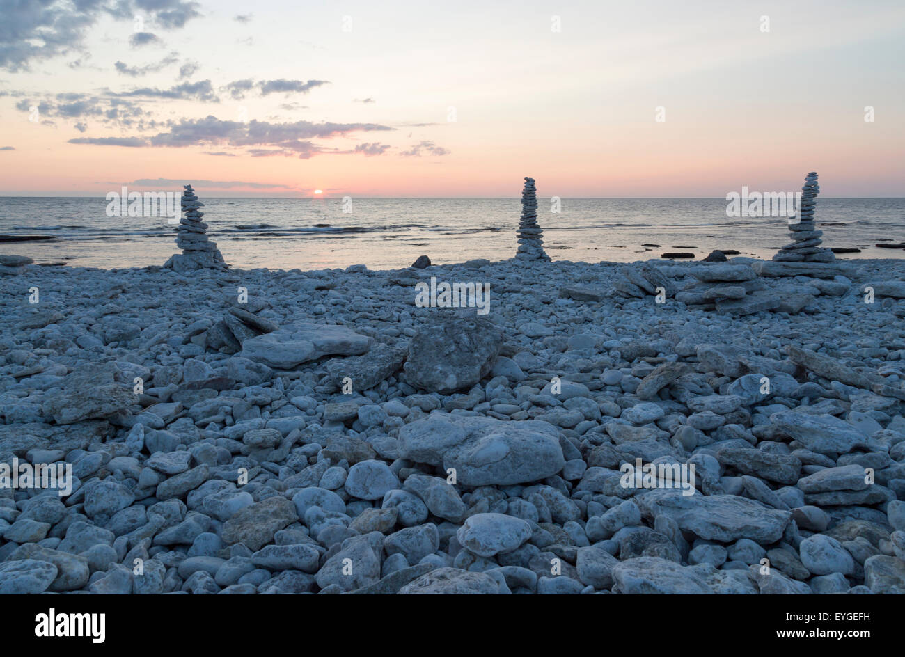 Rocks Piled on Each Other by ocean at sunset Stock Photo - Alamy