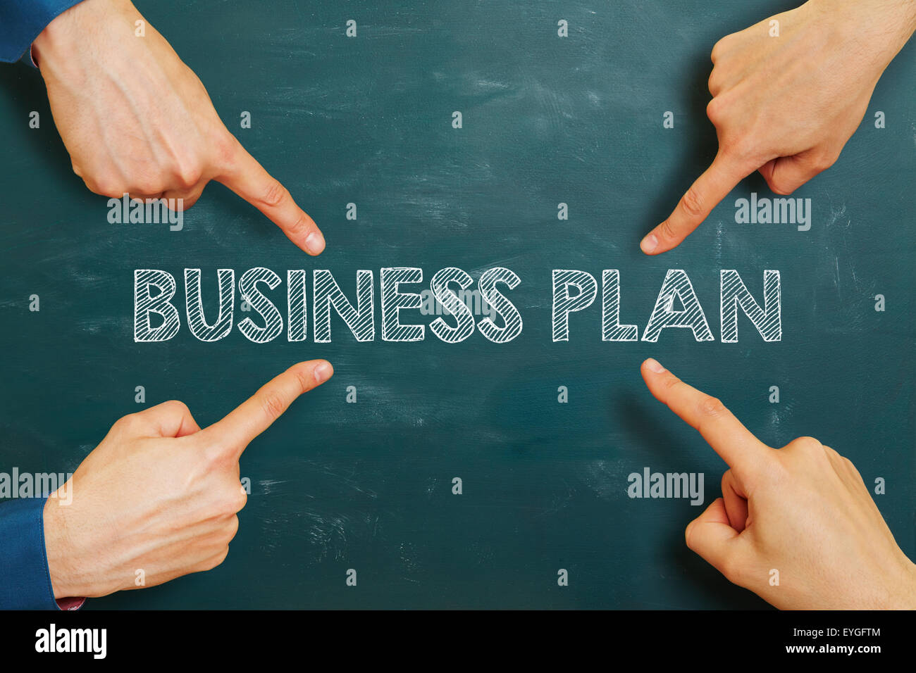 Many hands pointing to business plan on a chalkboard Stock Photo - Alamy