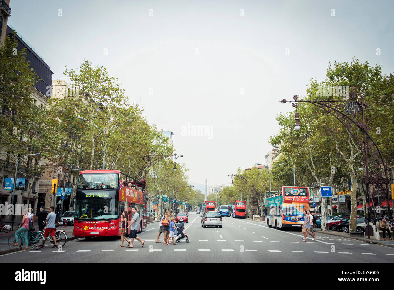 Spain, Street scene with people crossing busy road; Barcelona Stock ...