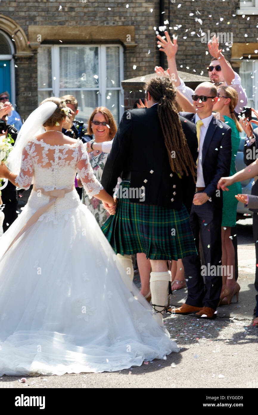Bride and groom leaving church after the wedding ceremony Stock Photo ...