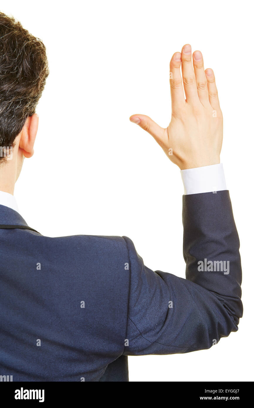 Politician from behind lifting his hand for an oath Stock Photo - Alamy