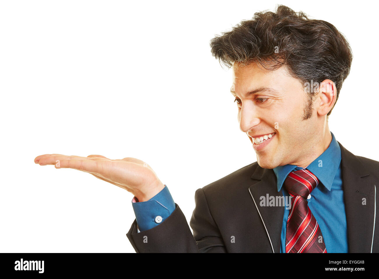 Smiling Business man presenting palm of his empty hand Stock Photo - Alamy