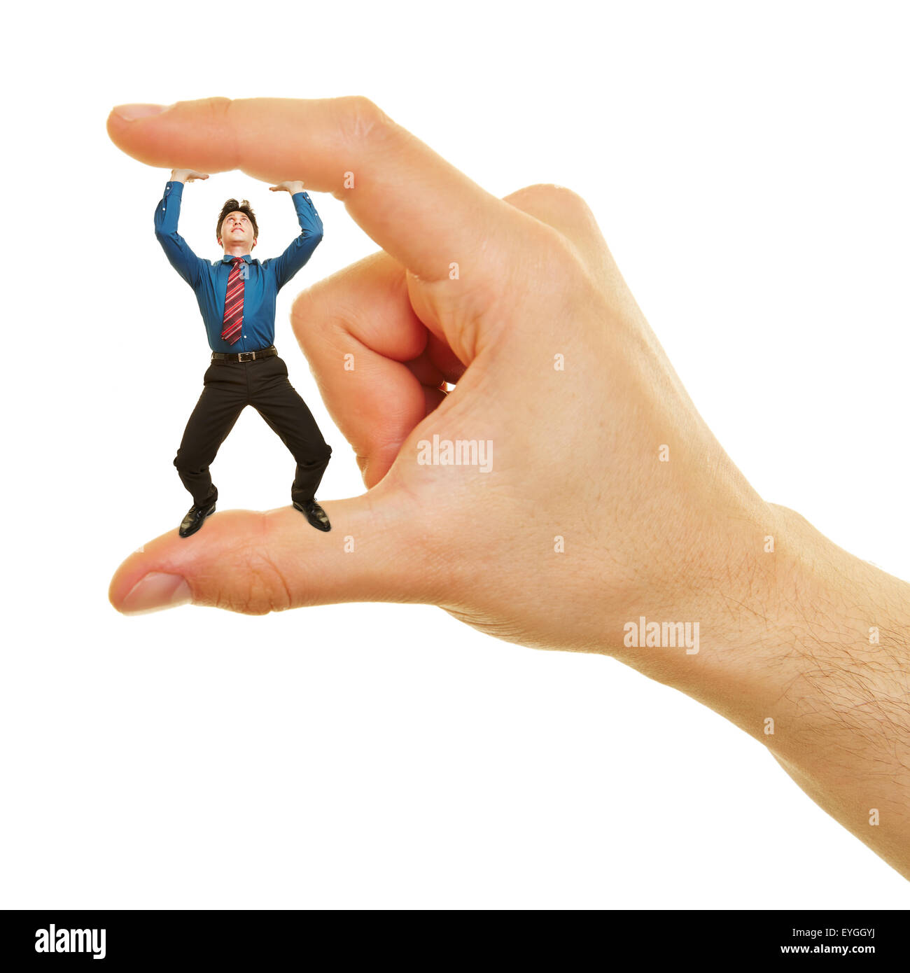 Small business man standing between two fingers Stock Photo - Alamy