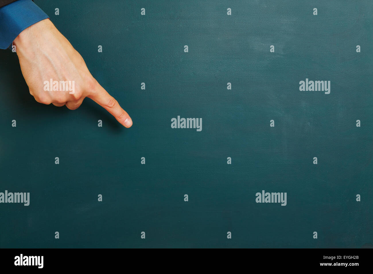 Teacher pointing with his hand to an empty chalkboard Stock Photo - Alamy
