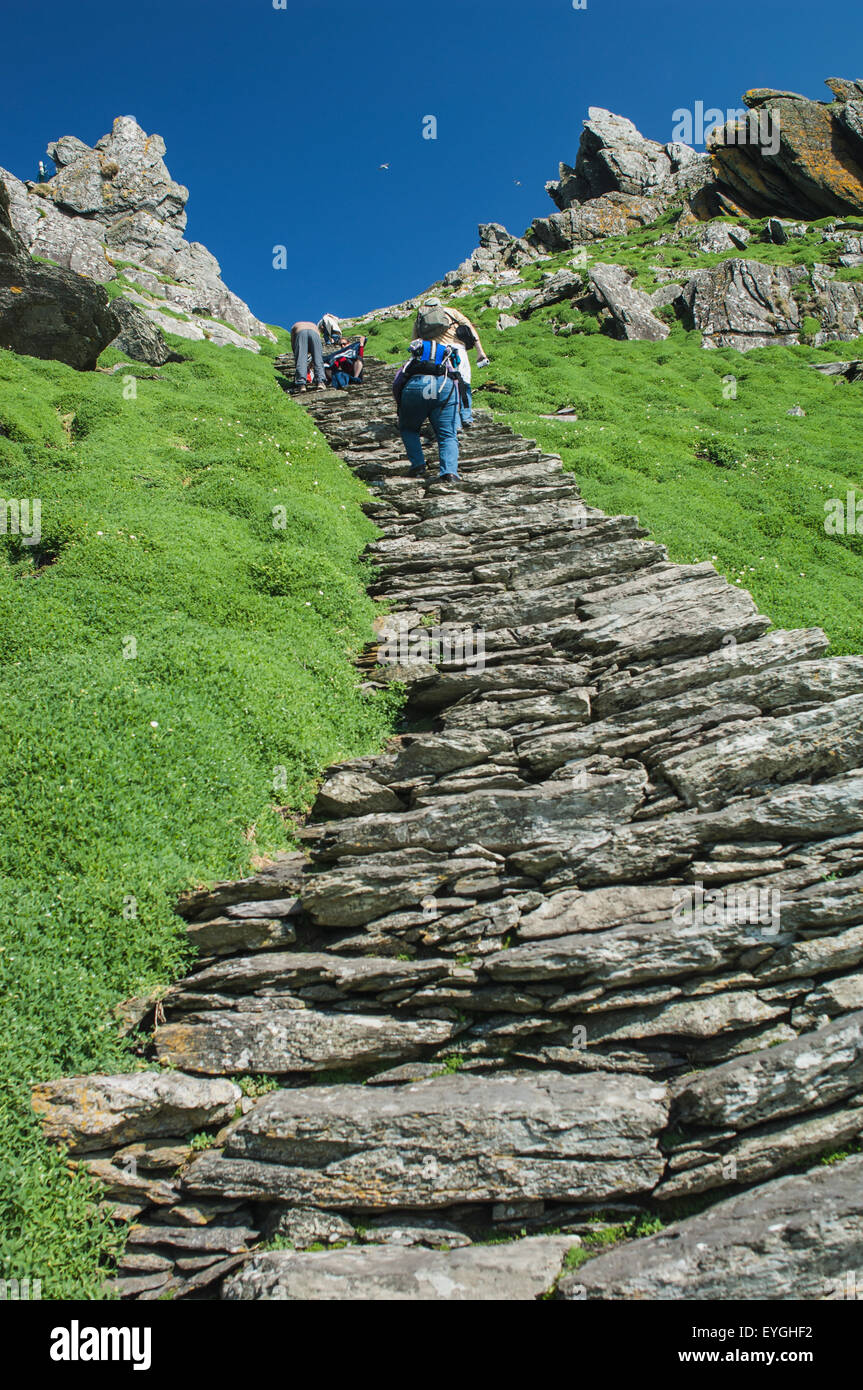 Tourists on footpath climbing up Skellig Michael; Skellig Islands ...