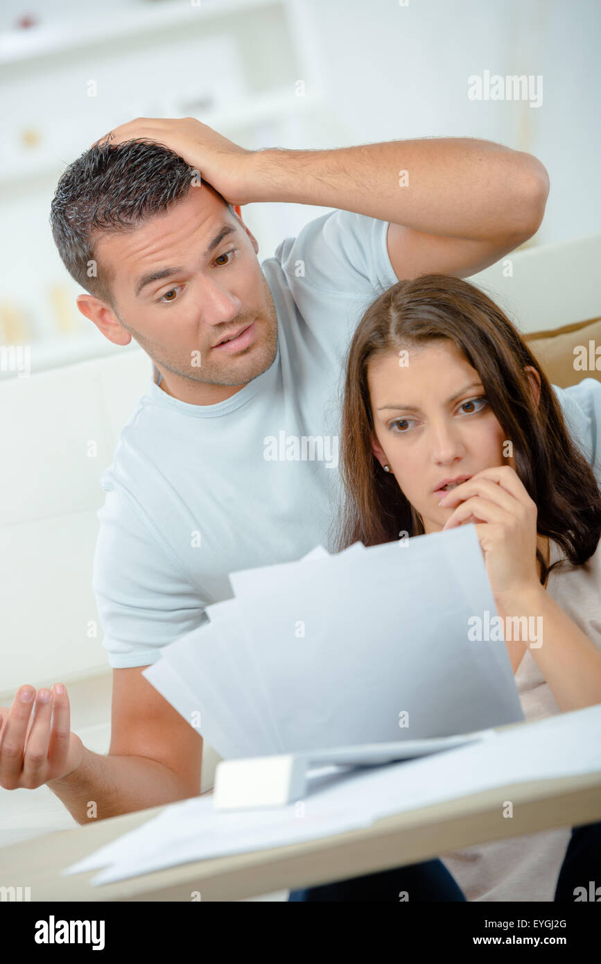Couple arguing over bills Stock Photo - Alamy