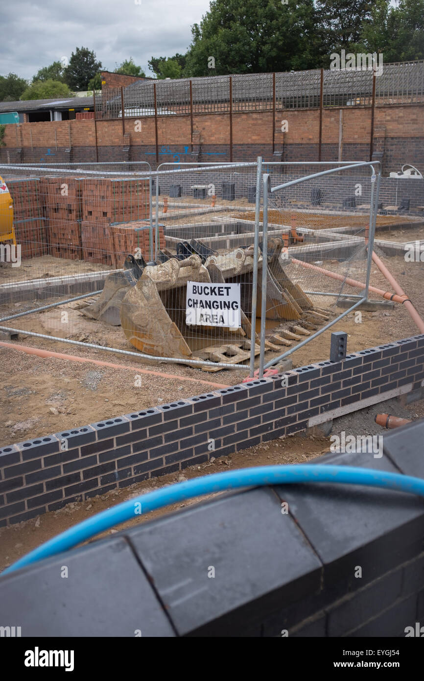 Bucket changing area on a UK construction building site Stock Photo - Alamy