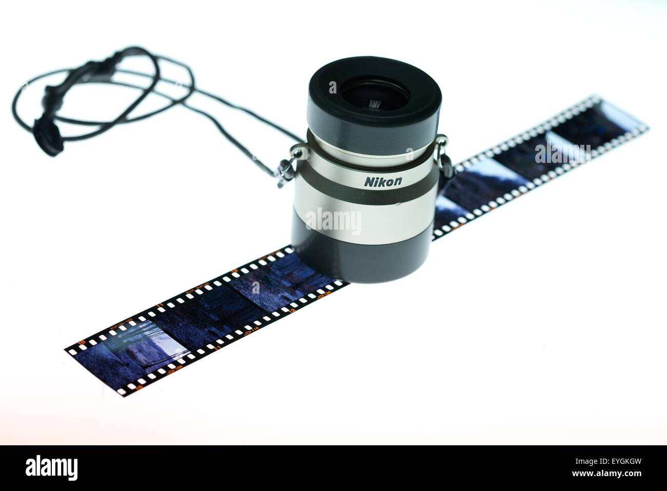 A photographers loope with Transparency film on a lightbox in a studio ...