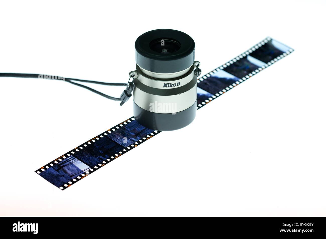 A photographers loope with Transparency film on a lightbox in a studio ...