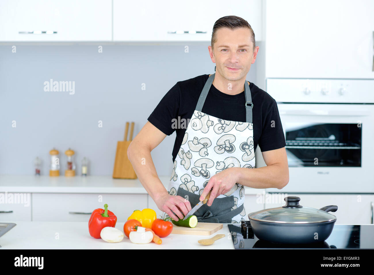 Man chopping vegetables Stock Photo - Alamy