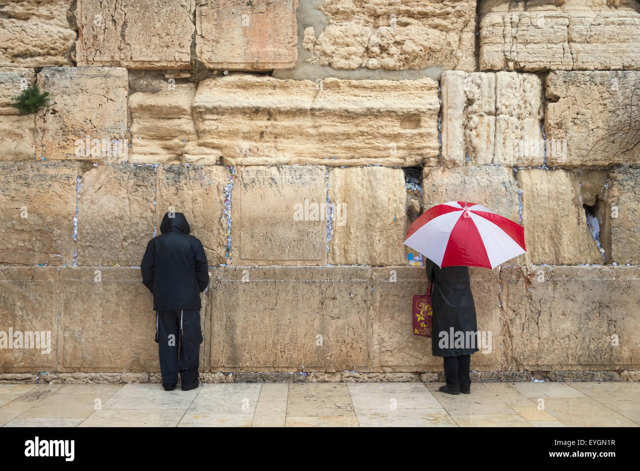 Israel, Jerusalem, Men praying at Western Wall on winter day; Jerusalem ...