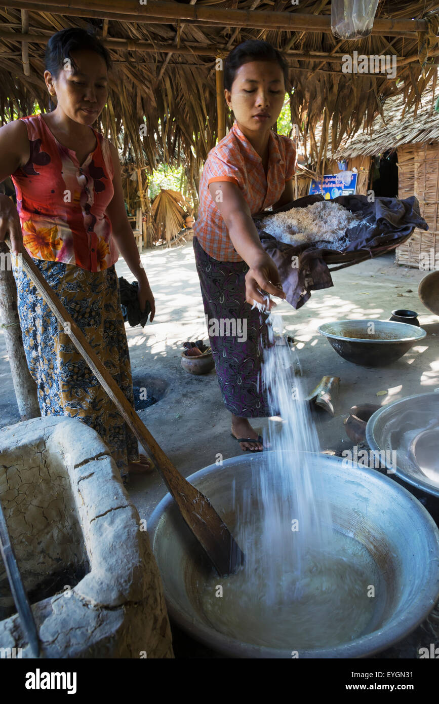 Myanmar, Irrawaddyi division, Women cooking todi juice candy; Myaung ...