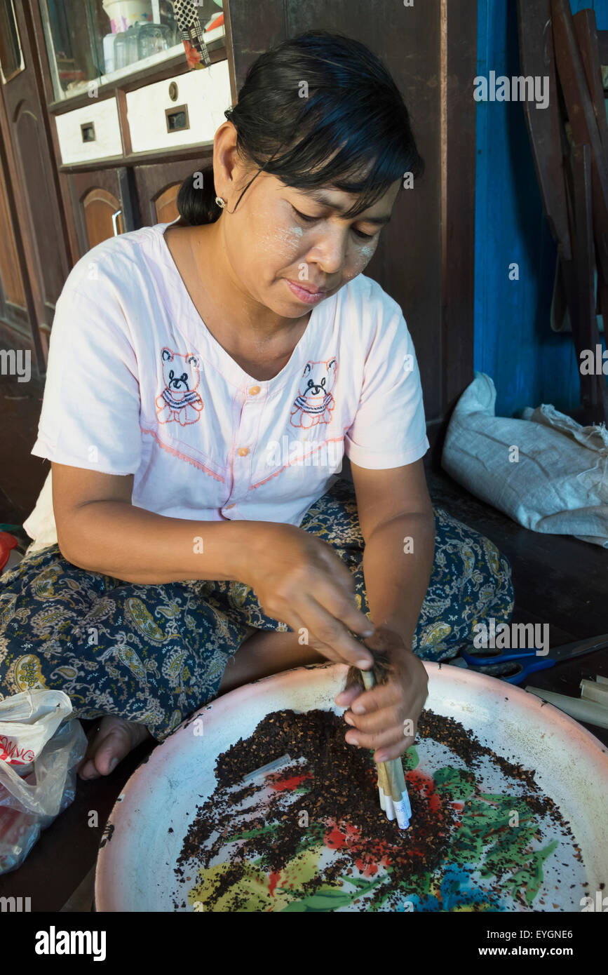 Myanmar (Burma), Woman making cheroot cigars by hand; Irrawaddyi ...