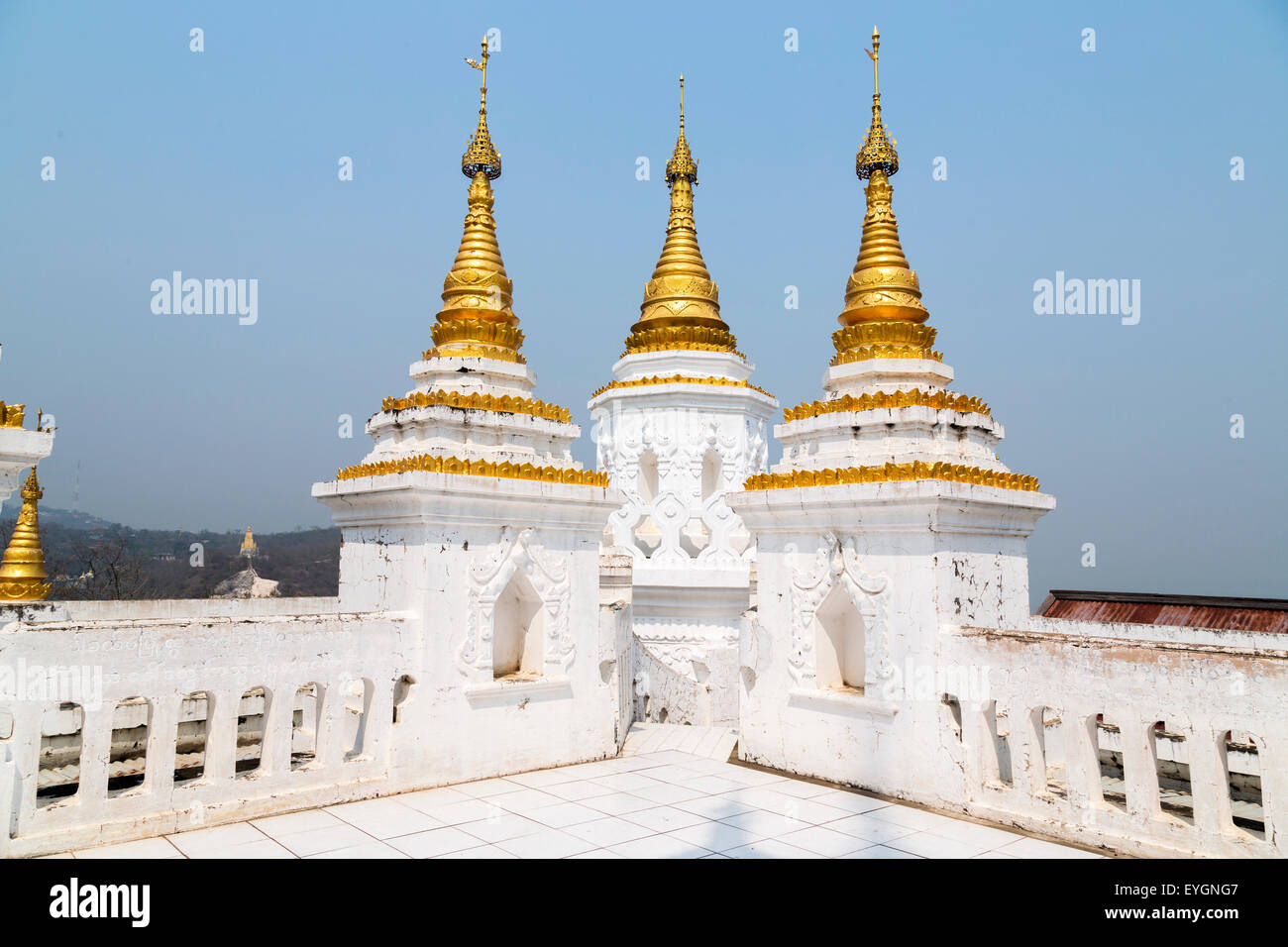 White pagoda is on Sagaing Hill, Myamar. On the top floor of temple ...