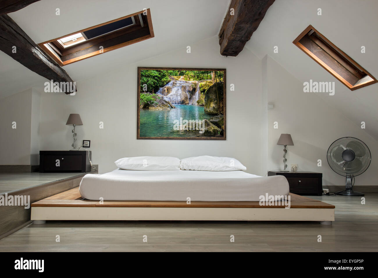 interior view of a bedroom in the attic room Stock Photo - Alamy
