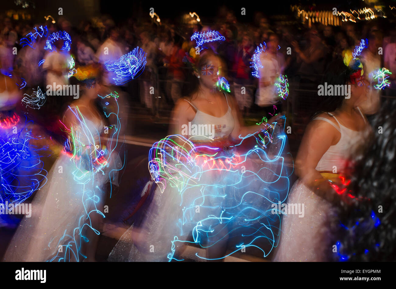 UK, Ladies parading and waving flash torch led wands; London Stock ...
