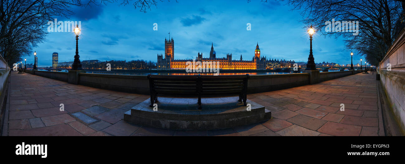 UK, Panoramic view of bench overlooking Houses of Parliament on River ...