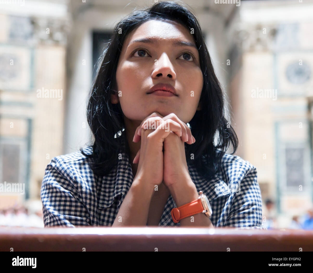 Woman praying in church Stock Photo - Alamy