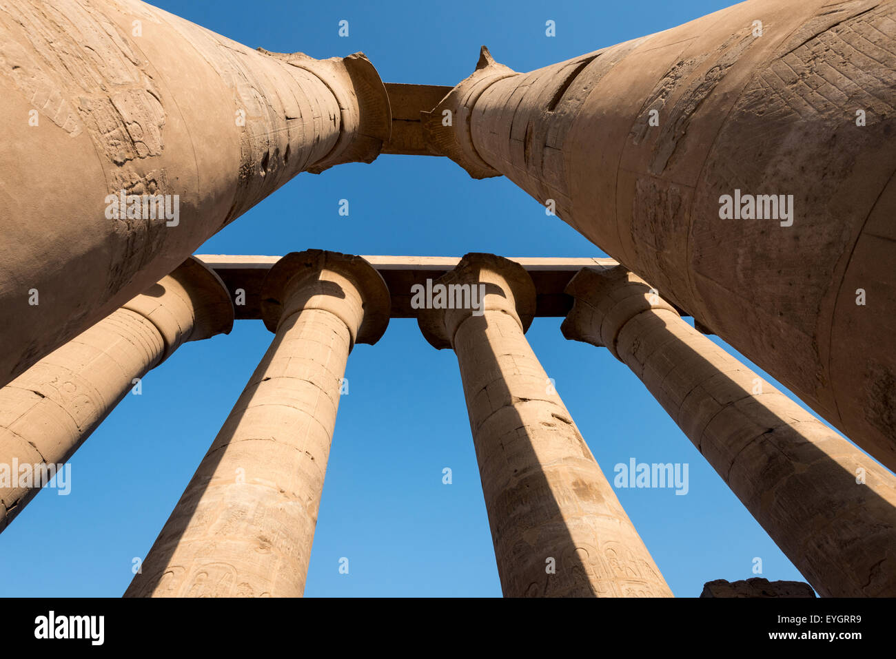 Columns in the setting sun at the temple in Luxor, Egypt Stock Photo ...