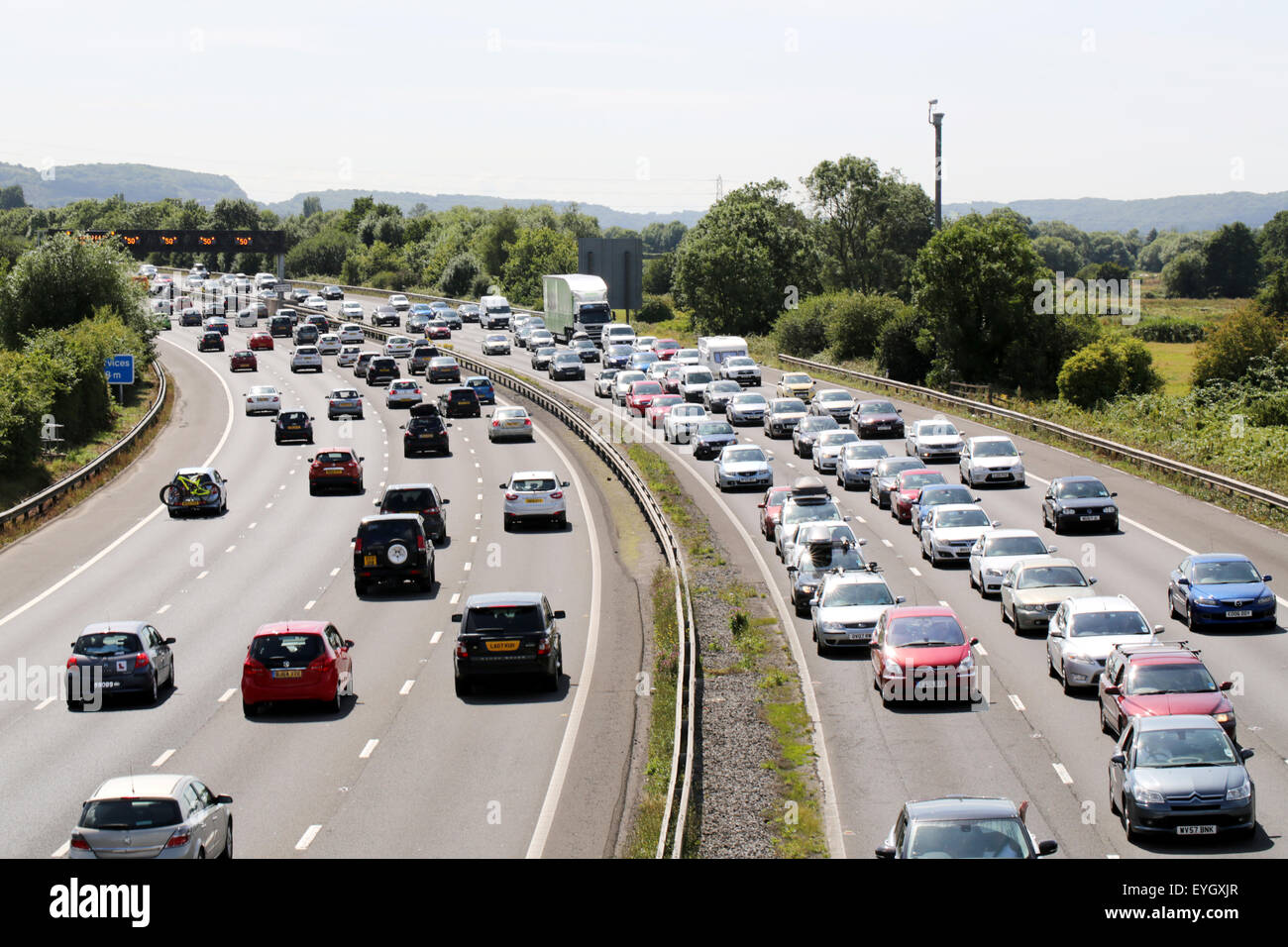 Queues of heavy traffic, in both directions, on the motorway during a ...