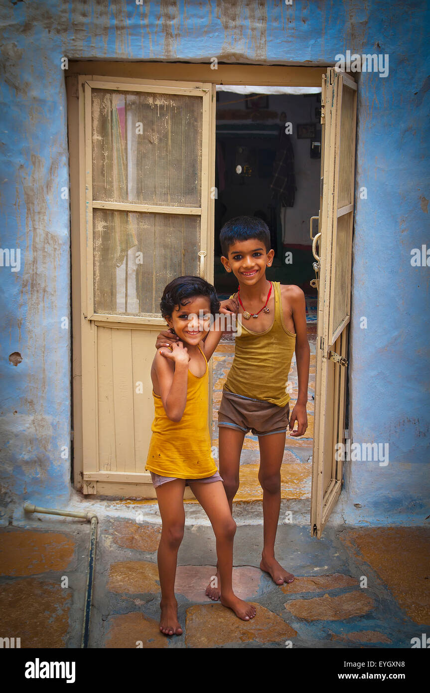 Sibling Posing In Front Of Weathered Door; Jaisalmer,, India Stock ...
