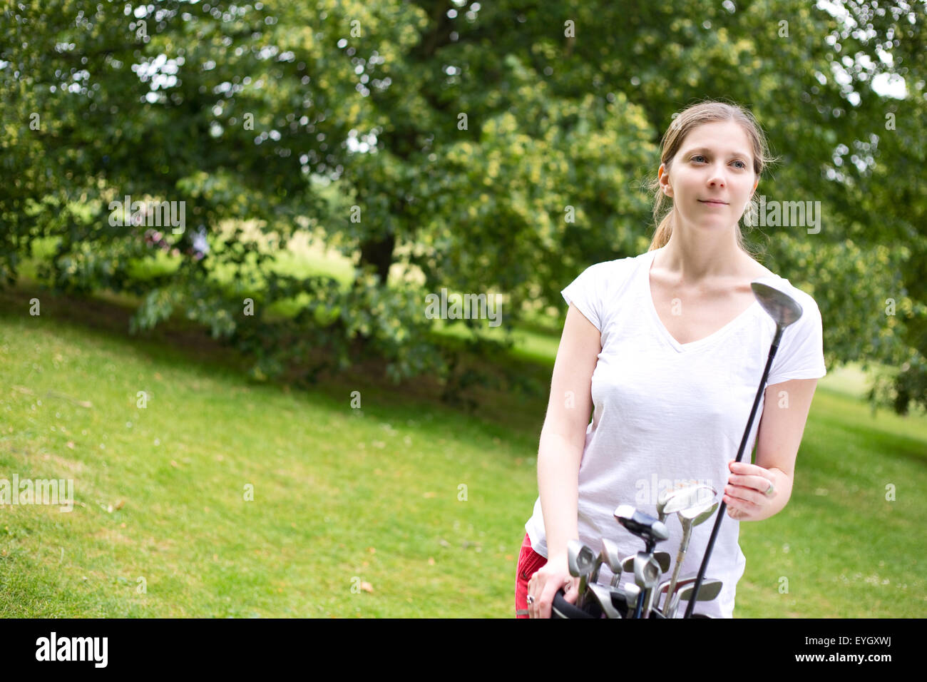 young woman choosing a golf club Stock Photo - Alamy