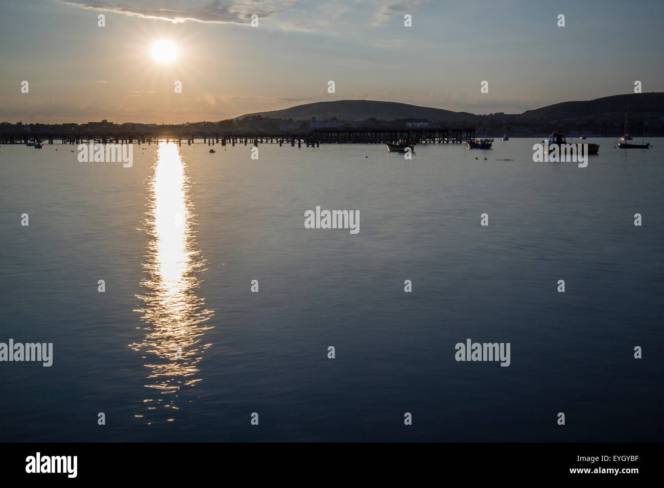 Pier in setting sun hi-res stock photography and images - Alamy