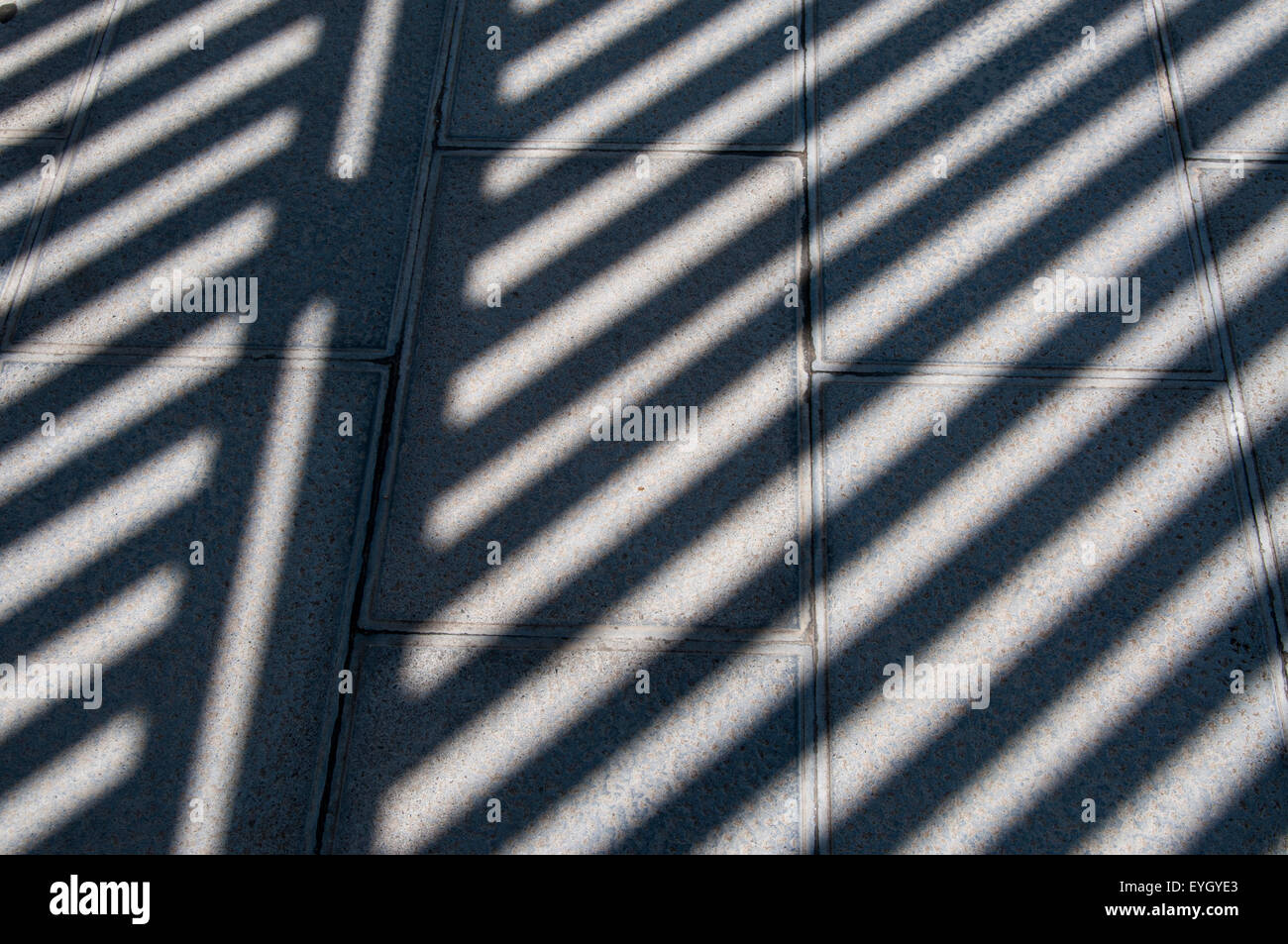 Shadow patterns on pavement, Barcelona Stock Photo - Alamy