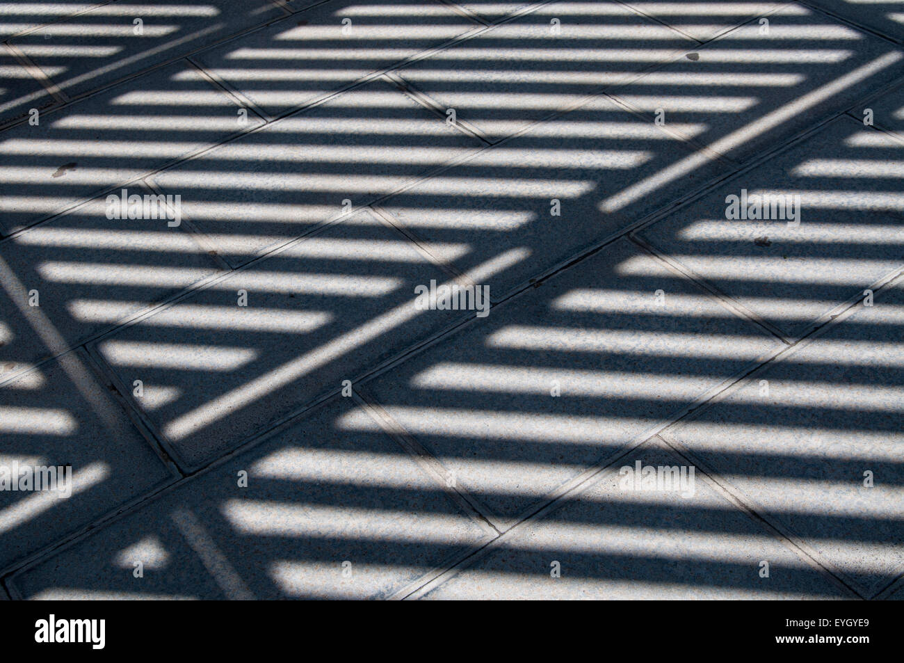 Shadow patterns on pavement, Barcelona Stock Photo - Alamy