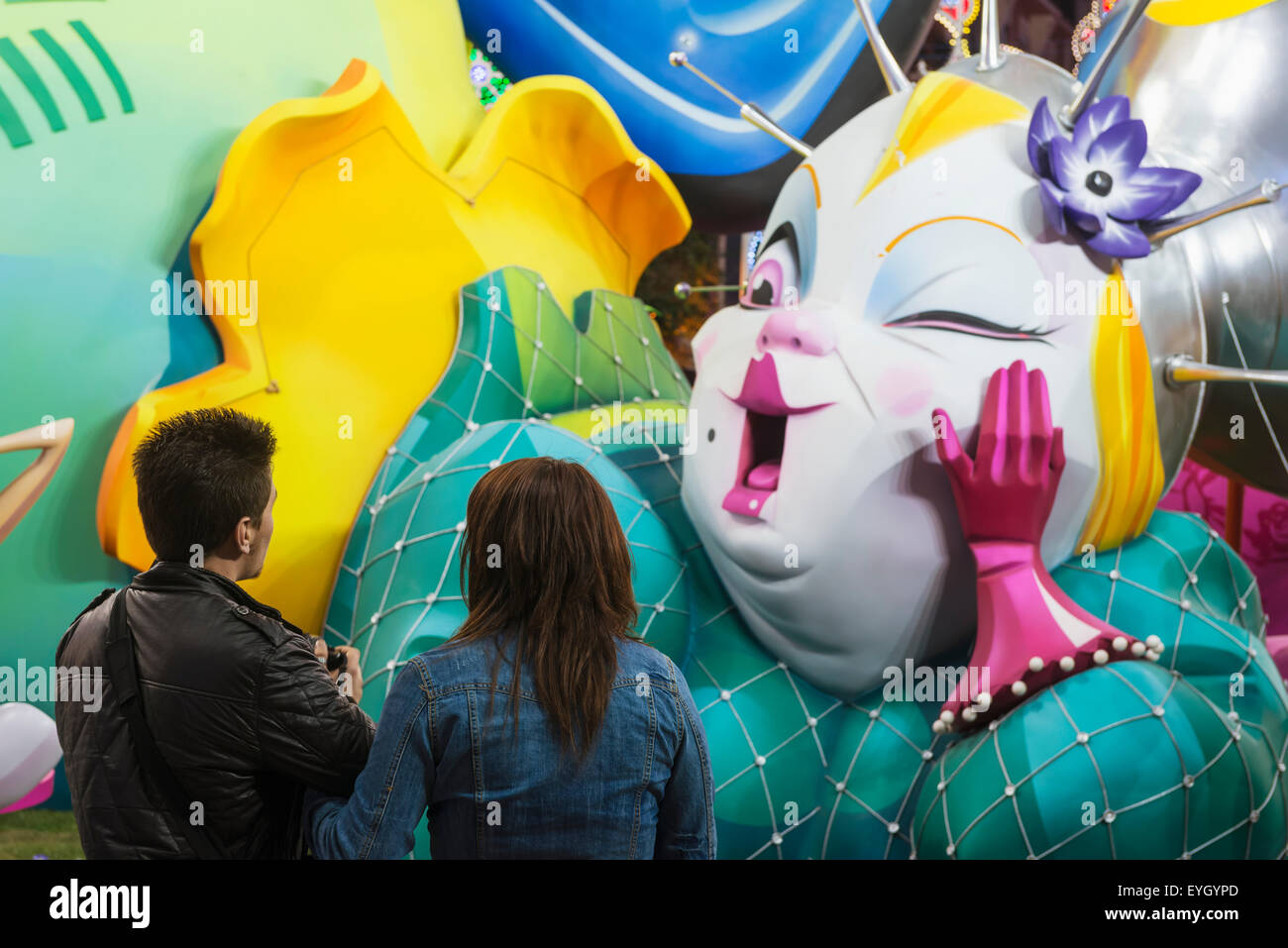 Couple Looking At Large Falla Displayed On Street As Part Of Fallas ...