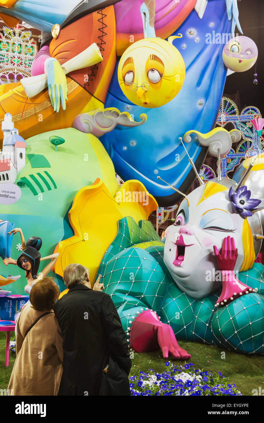 Couple Looking At Large Falla Displayed On Street As Part Of Fallas ...