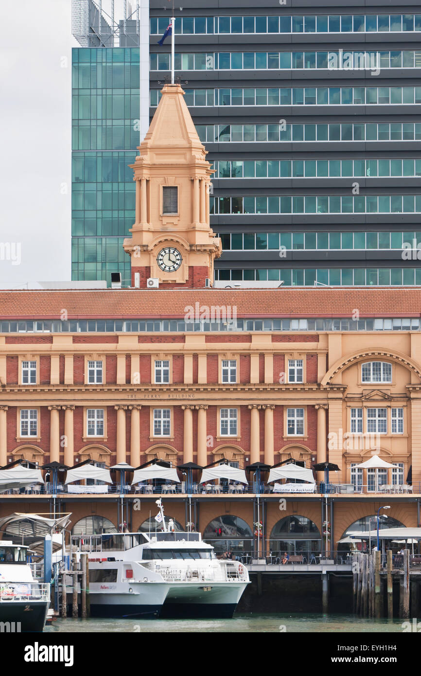Ferry Moored Near Building With Clock Tower; New Zealand Stock Photo ...