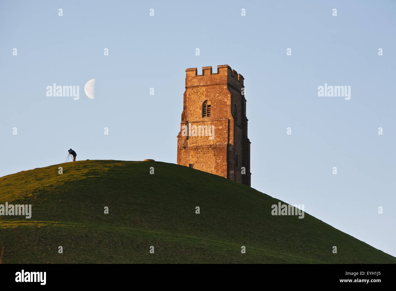 Man Watching Moon With A Telescope Near Tower; Glastonbury,Somerset ...