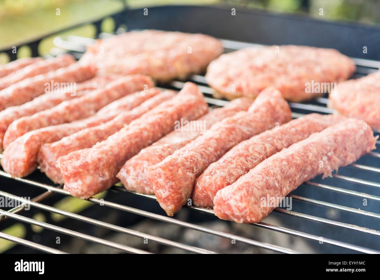Tasty meat on a barbeque Stock Photo - Alamy