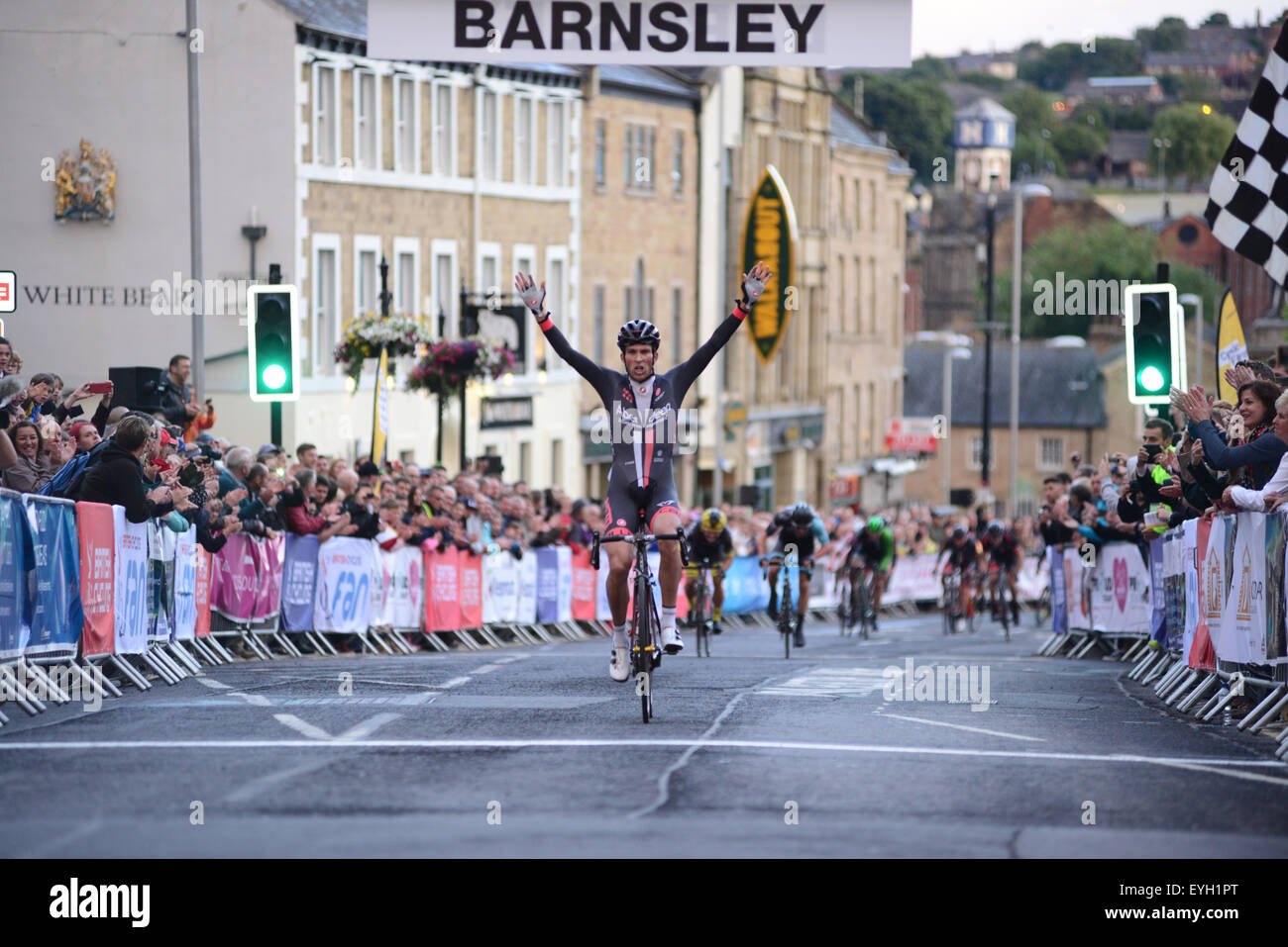 Barnsley, UK. 29th July 2015. Cyclist Ian Bibby crosses the finish line ...