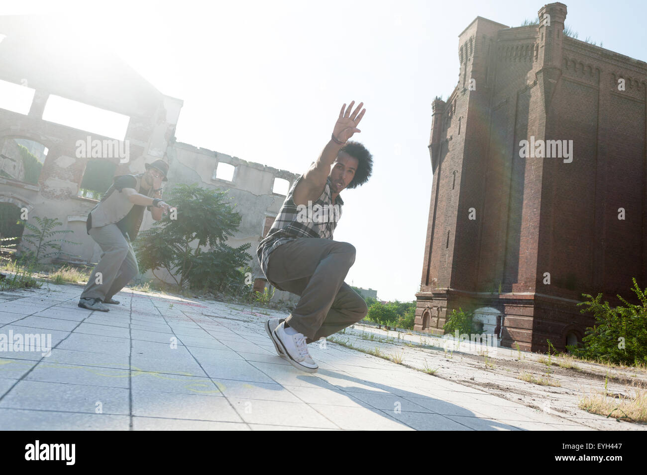 Low angle view of a young Afro-American man with an afro hair do hip ...