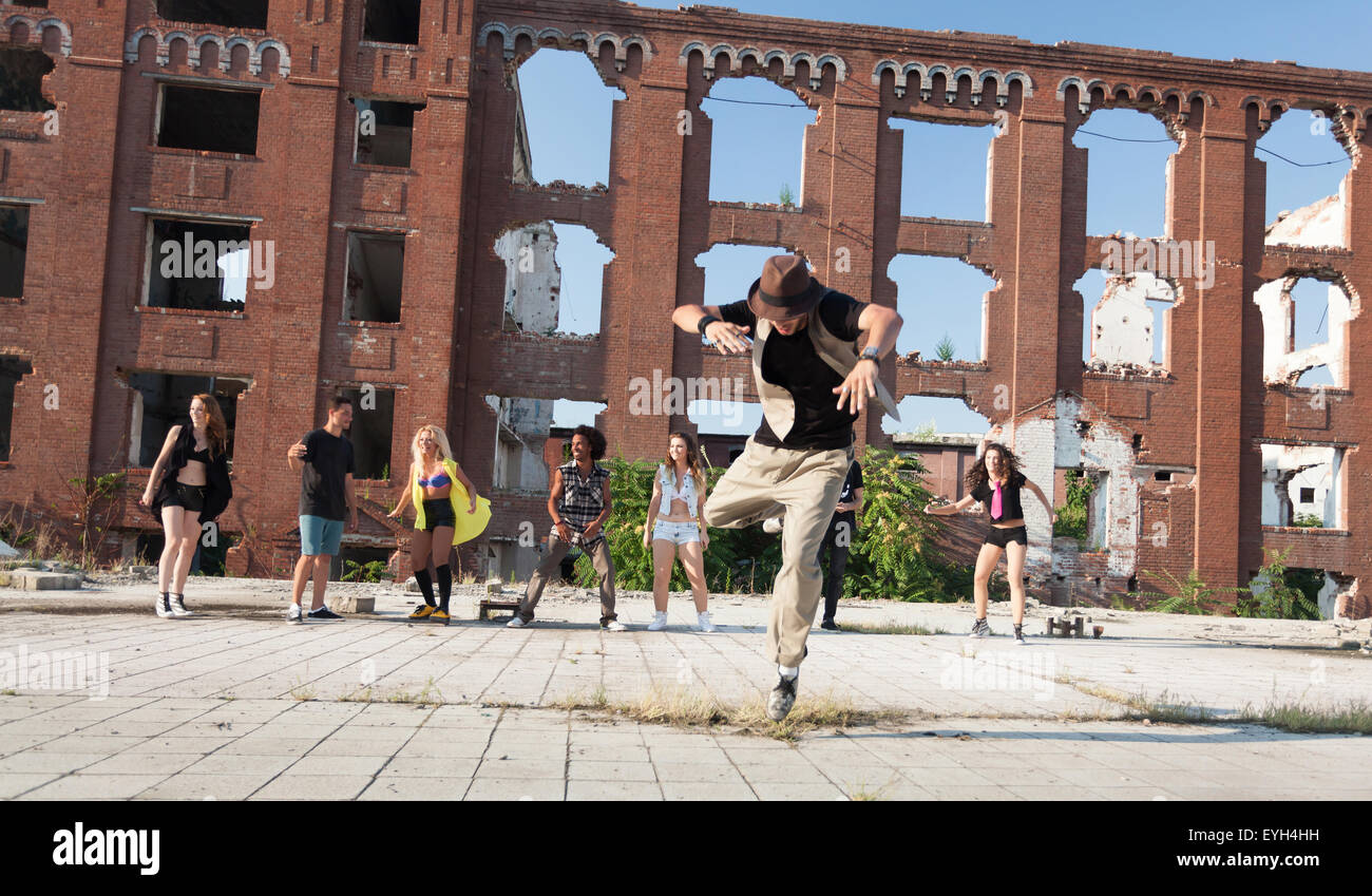 Energetic young hip hop street dancer performing his routine in an ...