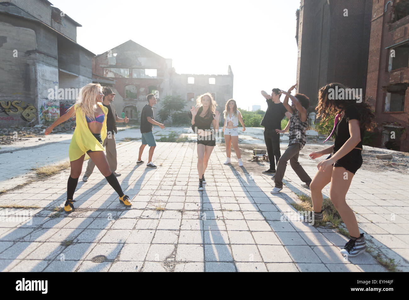 Energetic young people hip hop street dancers performing their routine ...
