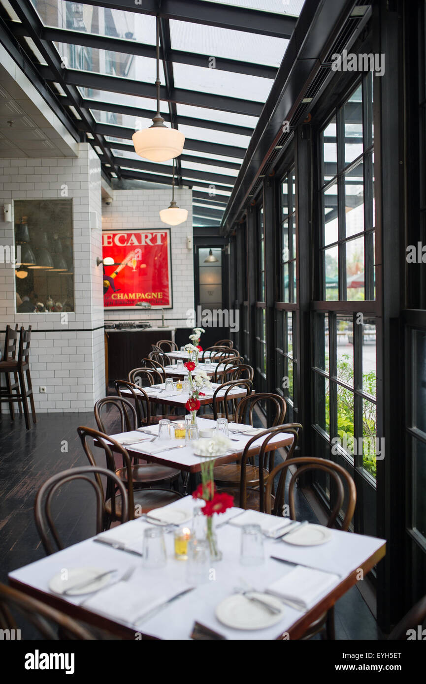 Tables and chairs at Cafe with windows 1 Stock Photo - Alamy