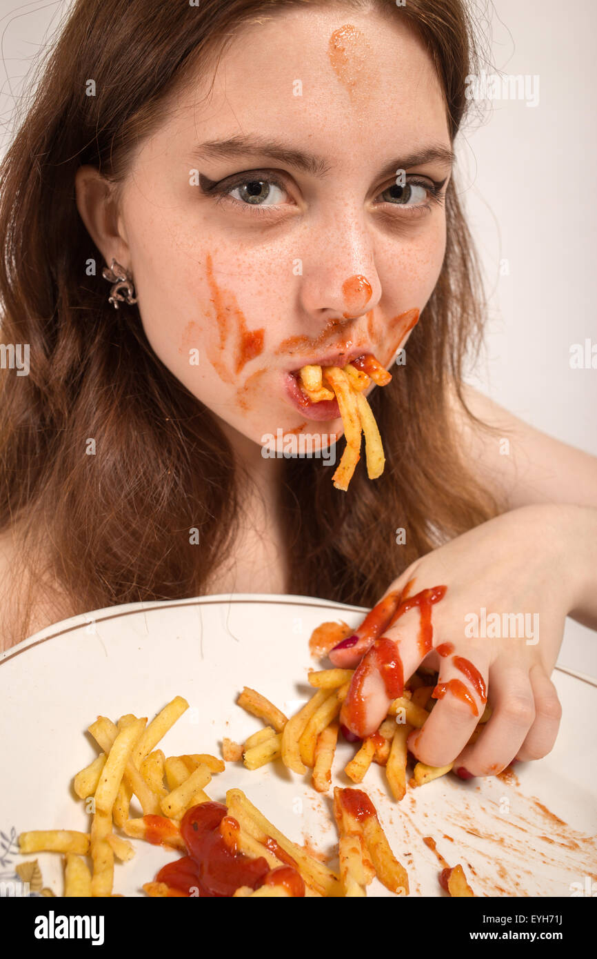 Fun Woman Eats French Fries Stock Photo - Alamy