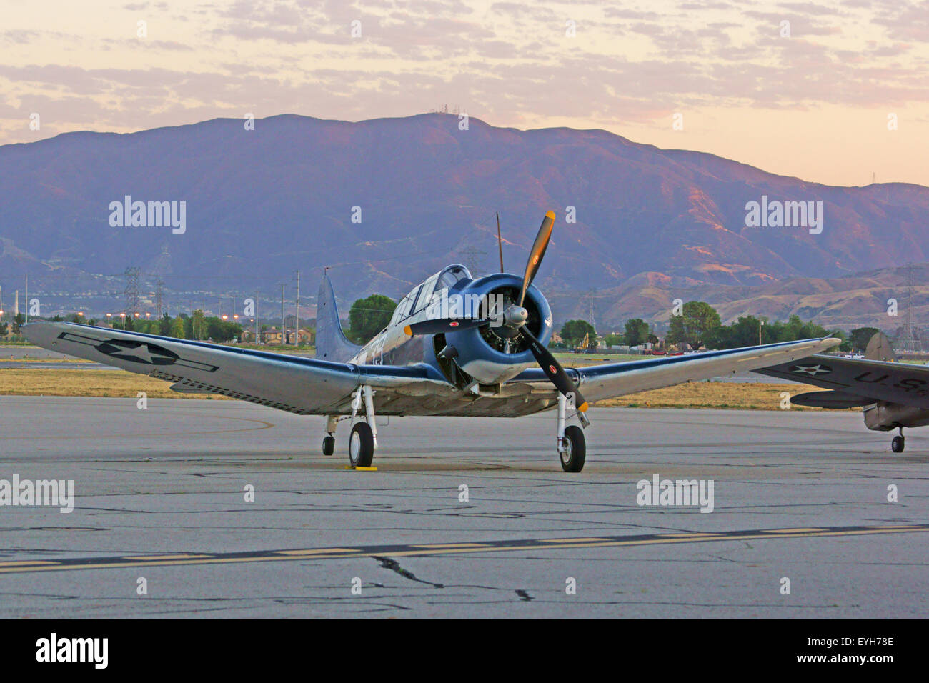 Airplane Vintage WWII aircraft on runway at Dusk Stock Photo - Alamy