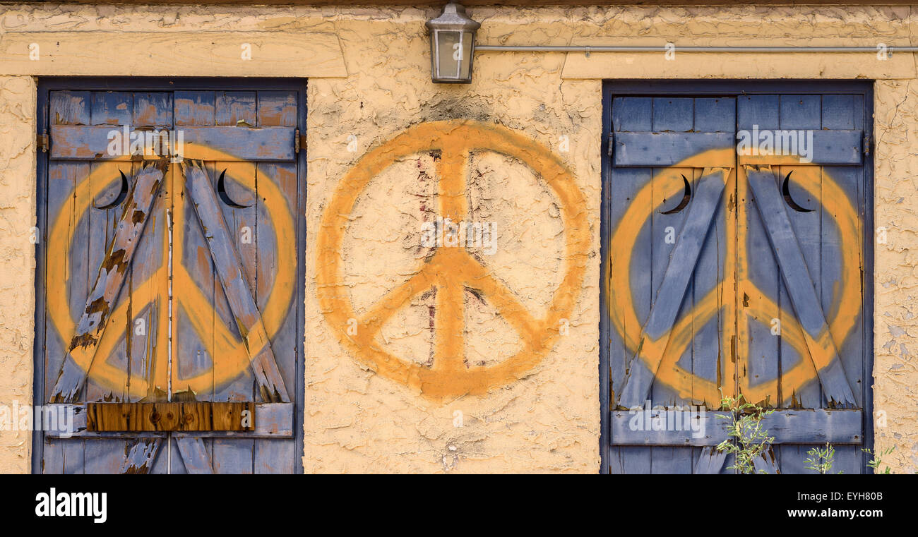 Peace sign repeated symbol on abandoned building Stock Photo - Alamy