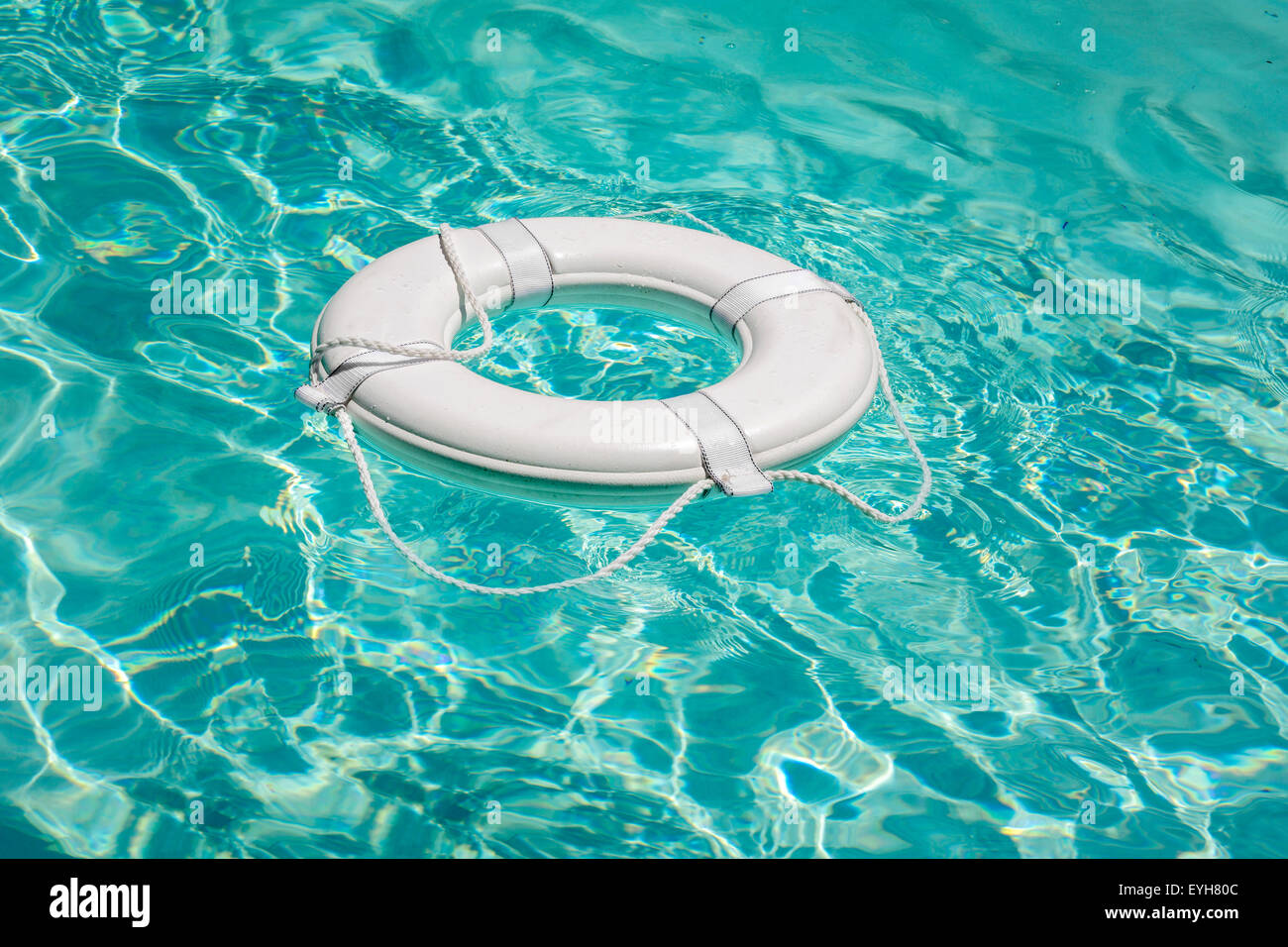 Life buoy in swimming pool life saver Stock Photo - Alamy