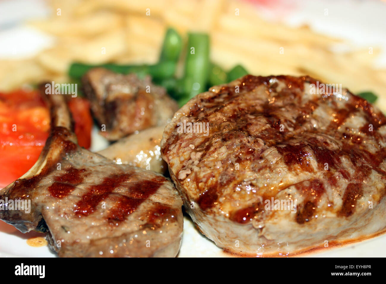 Fatty and juicy grilled meat at the restaurant Stock Photo - Alamy