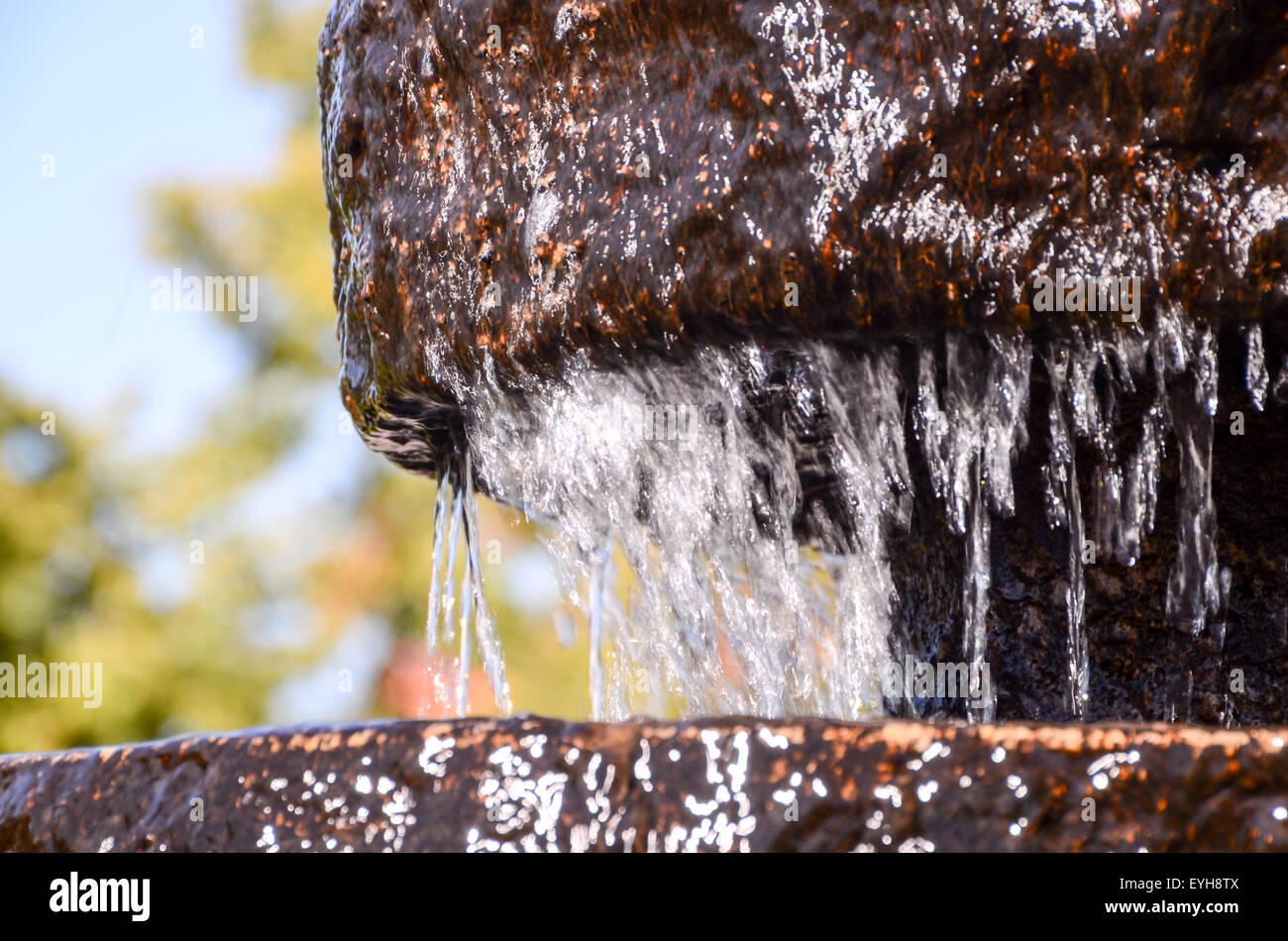 Water Dropping From a Fountain Stock Photo - Alamy